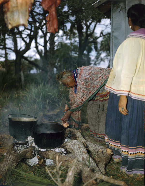 Florida Memory • View showing a Seminole woman cooking for a barbeque ...