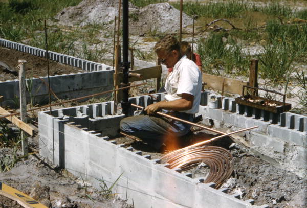 Florida Memory • Plumber installing pipes for a house under ...