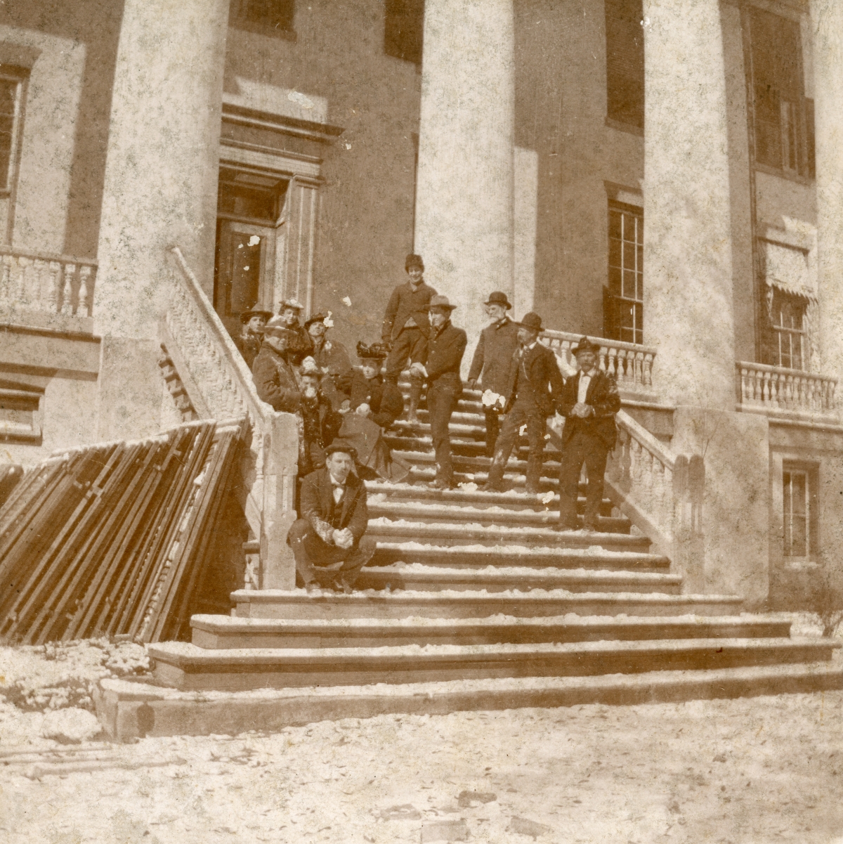 Florida Memory • Men and women on the snow-covered steps of the Capitol.