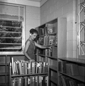 Florida Memory • Librarian shelving books at Leon County Public Library ...