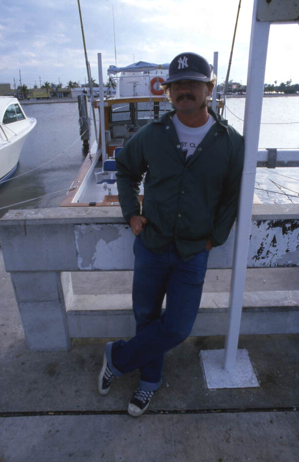 Florida Memory • Boat captain standing at the charter fishing docks in ...