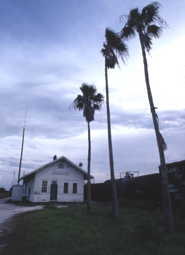 Florida Memory • Close-up view showing train depot and railroad cars in ...