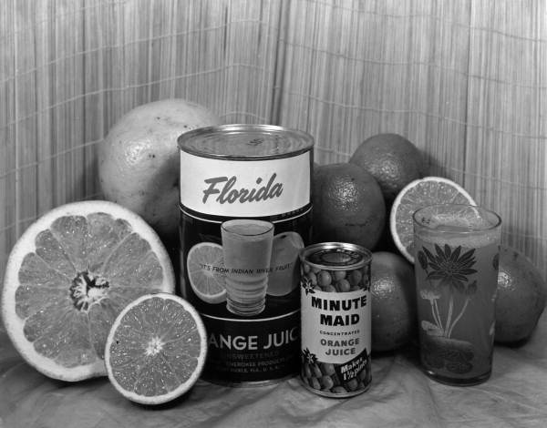 Florida Memory • Citrus fruit and orange juices on display - Florida