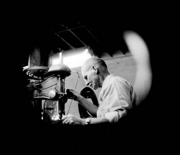 Florida Memory • View of unidentified man working at Rex Bassett ...