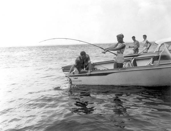 Florida Memory • Joe Kingry landing a red snapper caught by Nancy Beach ...
