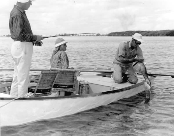 Florida Memory • Mr. and Mrs. Lou Doherty and their guide reel in a ...