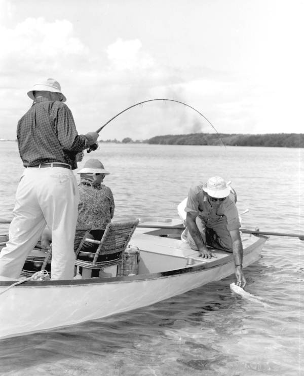 Florida Memory • Mr. and Mrs. Lou Doherty and their guide reel in a ...