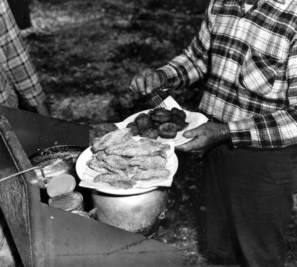 Florida Memory • A man frying fish and hush-puppies outdoors for a picnic