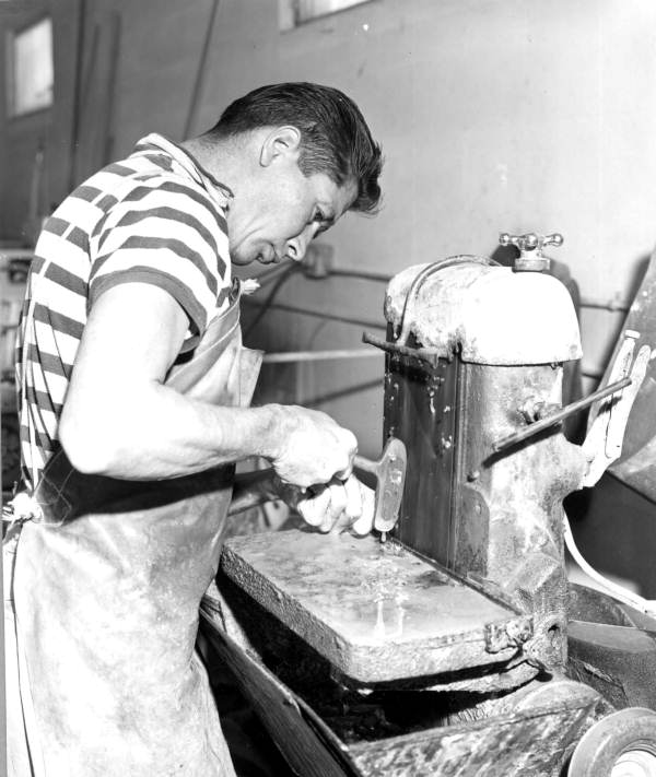 Florida Memory • Employee, Robert Bebout works on part of the golf club ...