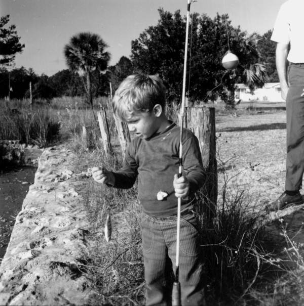 Florida Memory • Kevin Neal preparing to fish with his fishing rod ...
