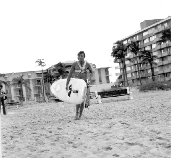 Florida Memory • Windsurfer walks on the beach