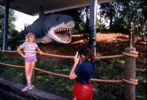 Florida Memory • Visitor posing with shark sculpture at the Sea World ...