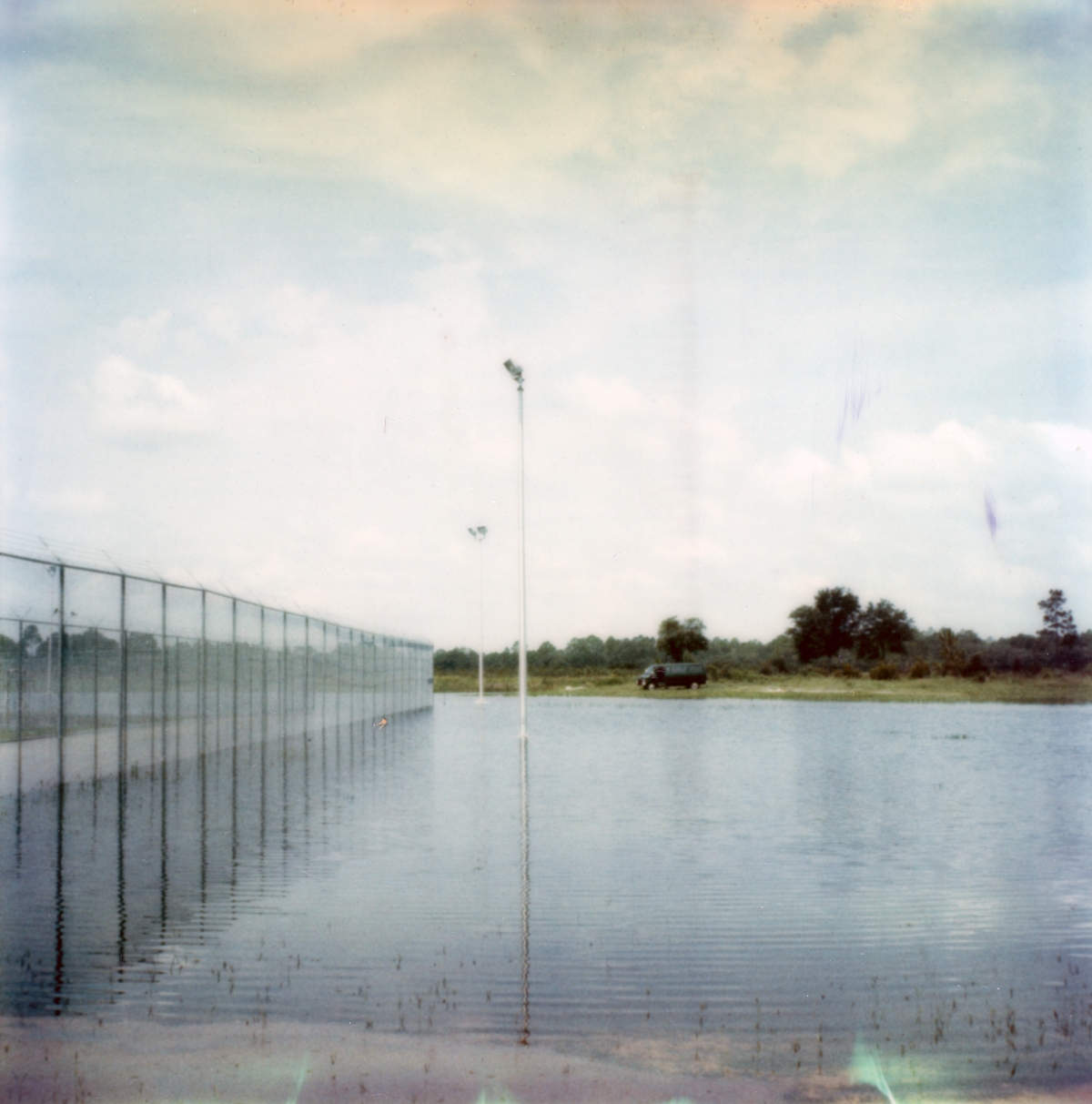 Florida Memory • Flooding along the north fence at the Cross City ...