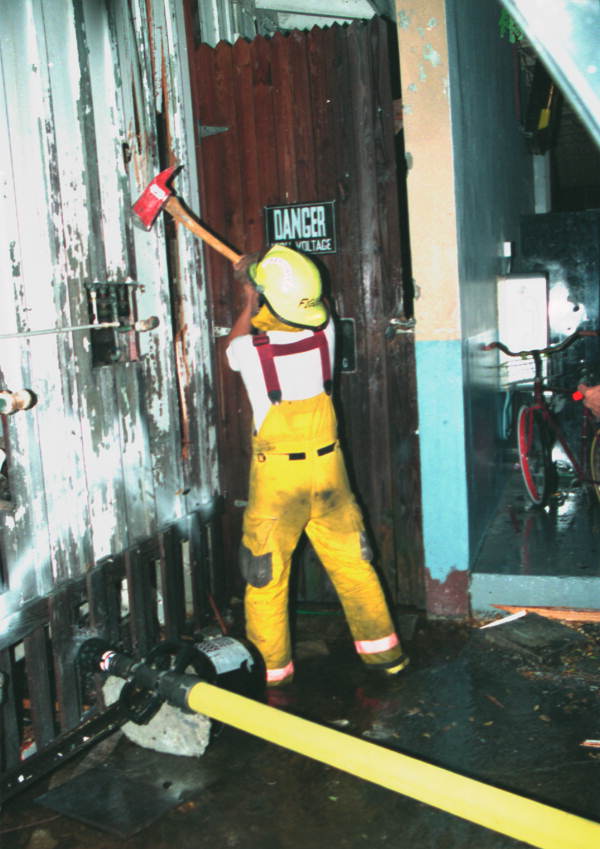 Florida Memory • NAS Key West firefighter Jeffrey Figueroa cutting ...