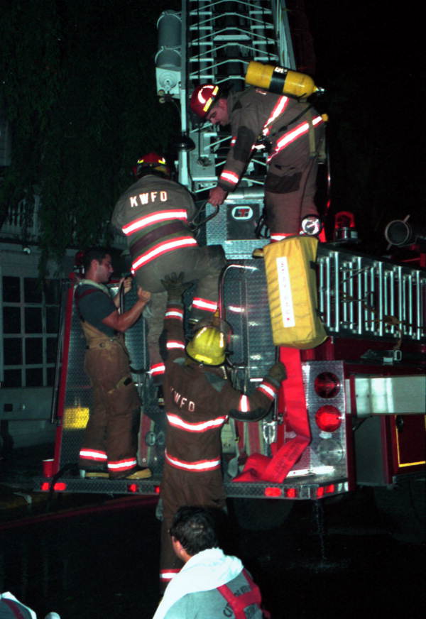 Florida Memory • Firefighters assisting fellow fighter off of ladder ...