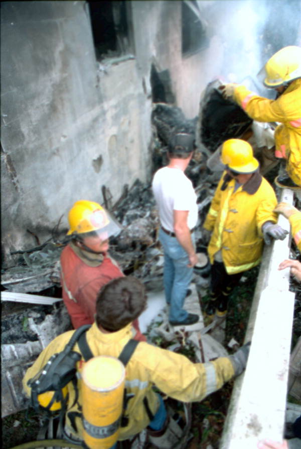 Florida Memory • KWFD firefighters inspecting wreckage created by small ...