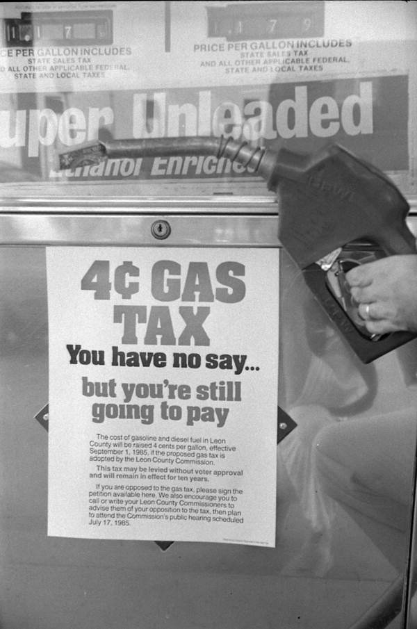 Florida Memory • Gas pump and gas tax sign - Tallahassee, Florida.