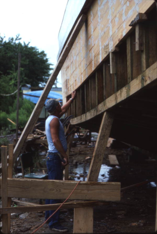 Florida Memory • Charles Herrin inspecting the chine line and caulking ...