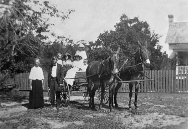 Florida Memory • Kelley family members standing next to and sitting in ...