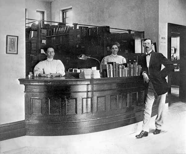 Florida Memory • Library staff at circulation desk.