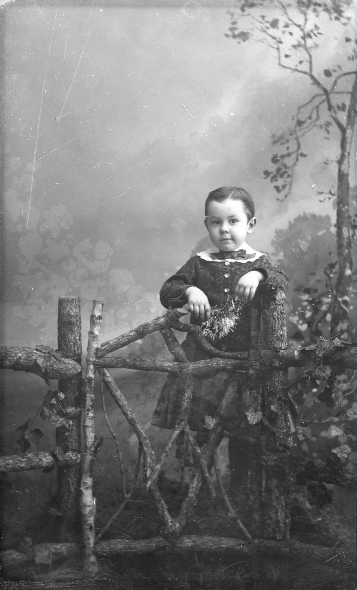 Florida Memory • Boy standing behind the gate.