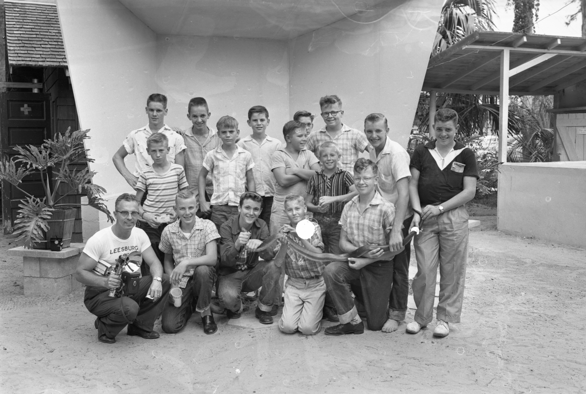 Florida Memory • Visitors posing with a snake at Ross Allen's Reptile ...