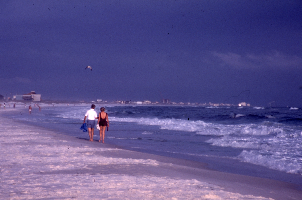 Florida Memory • Couple walking along the beach - Destin, Florida