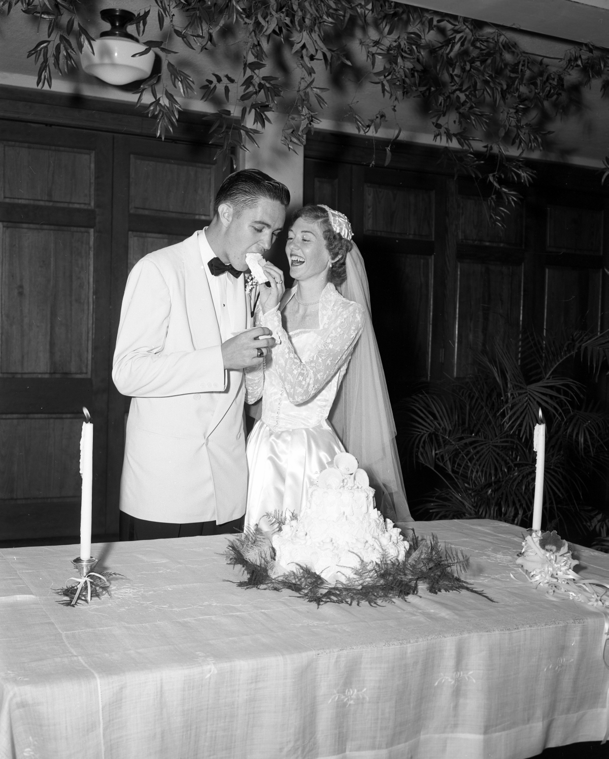 Florida Memory • Bride feeding the groom wedding cake.