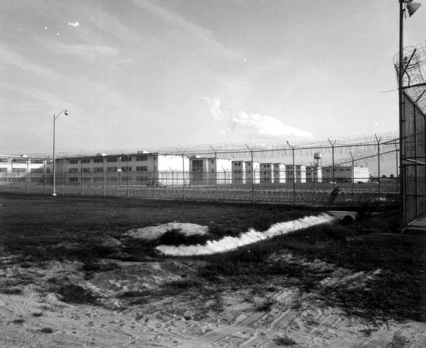 Florida Memory • Looking at the U.C.I. behind rows of barbed wire ...