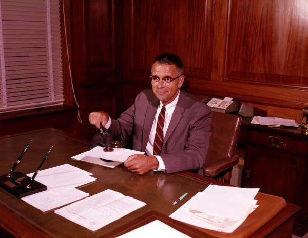 Florida Memory • Secretary of State Tom Adams stamping document at his ...