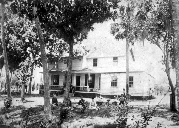 Florida Memory • Family in front of their home on the Saint Johns River ...