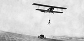 Florida Memory • Daredevil transfer of person between airplane and race car
