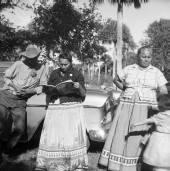 Florida Memory • Seminole Indian Willie Gopher and his wife looking at ...